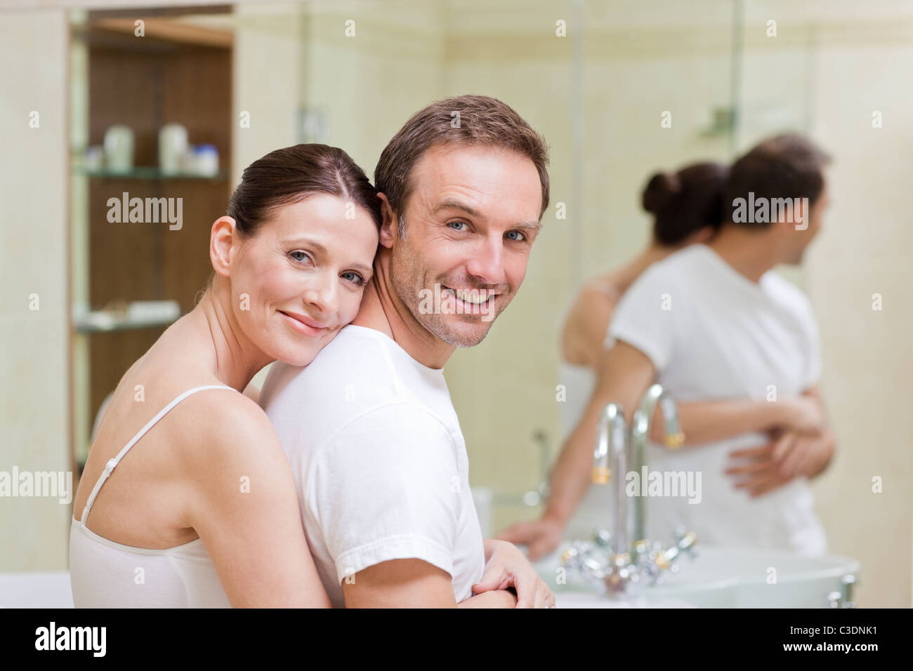 Couple hugging in the bathroom Stock Photo - Alamy