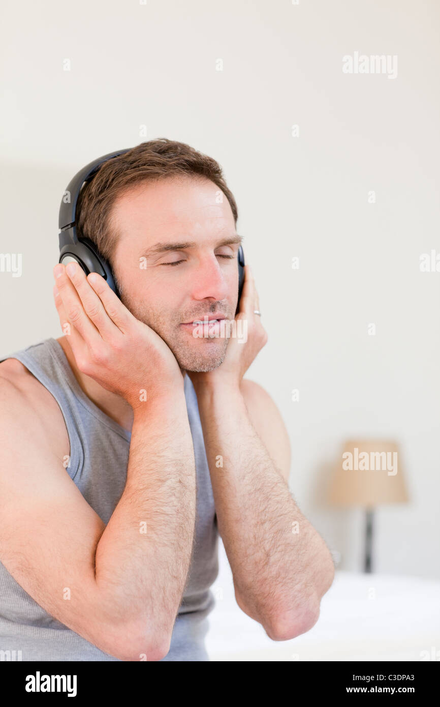Handsome man listening to some music Stock Photo - Alamy