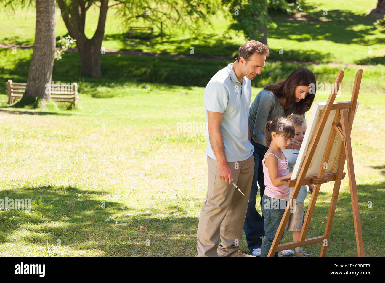 Family painting together in the park Stock Photo - Alamy