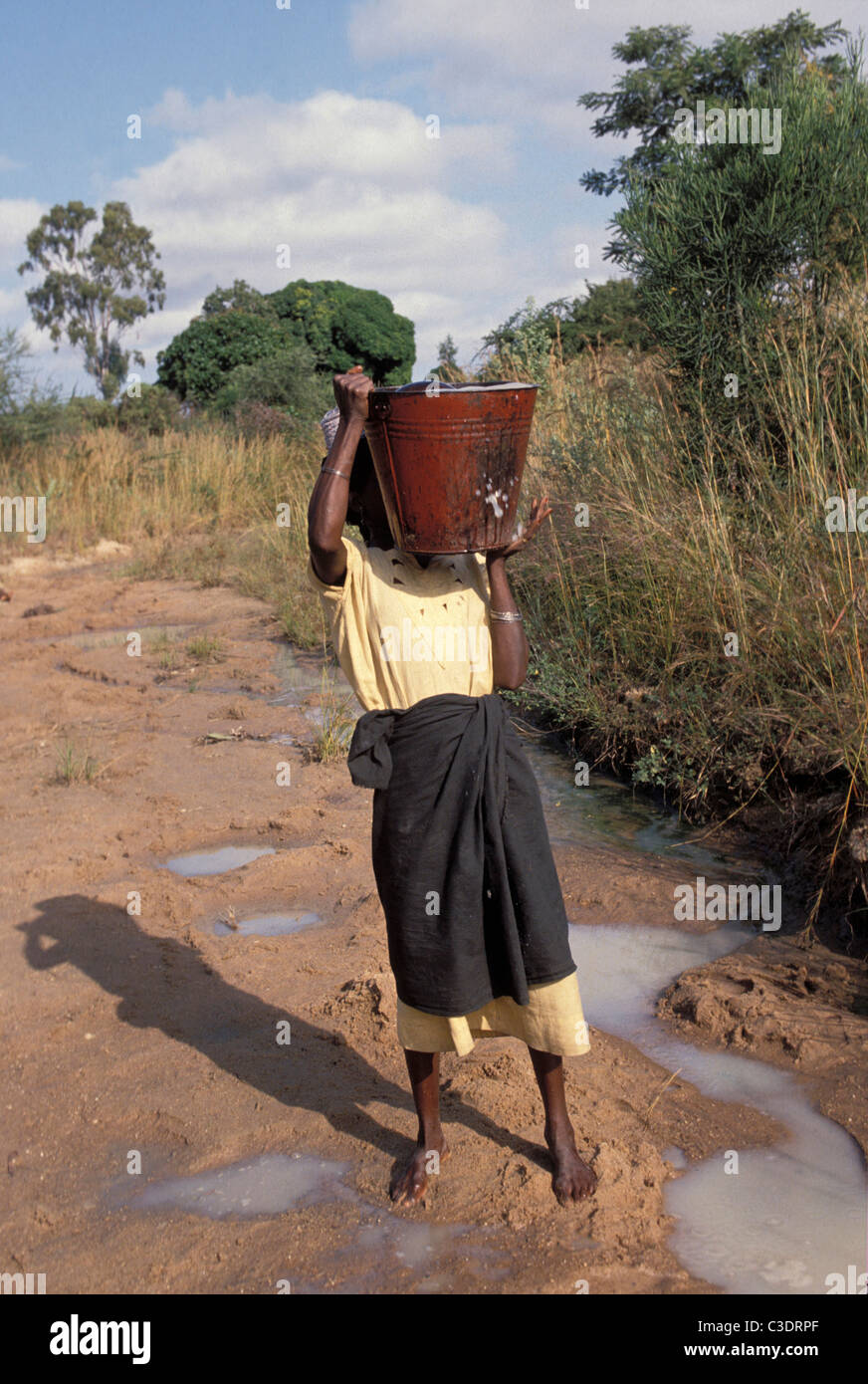 Woman fetching water from the river hi-res stock photography and images ...