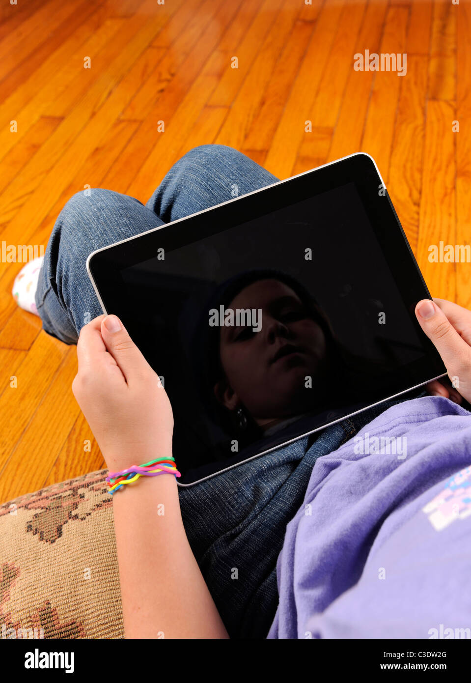 10 year old girl with blank Apple IPad in her lap Stock Photo - Alamy
