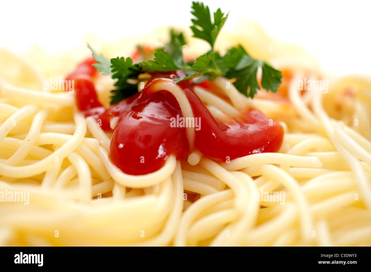 spaghetti with ketchup and parsley isolated on white background,close ...
