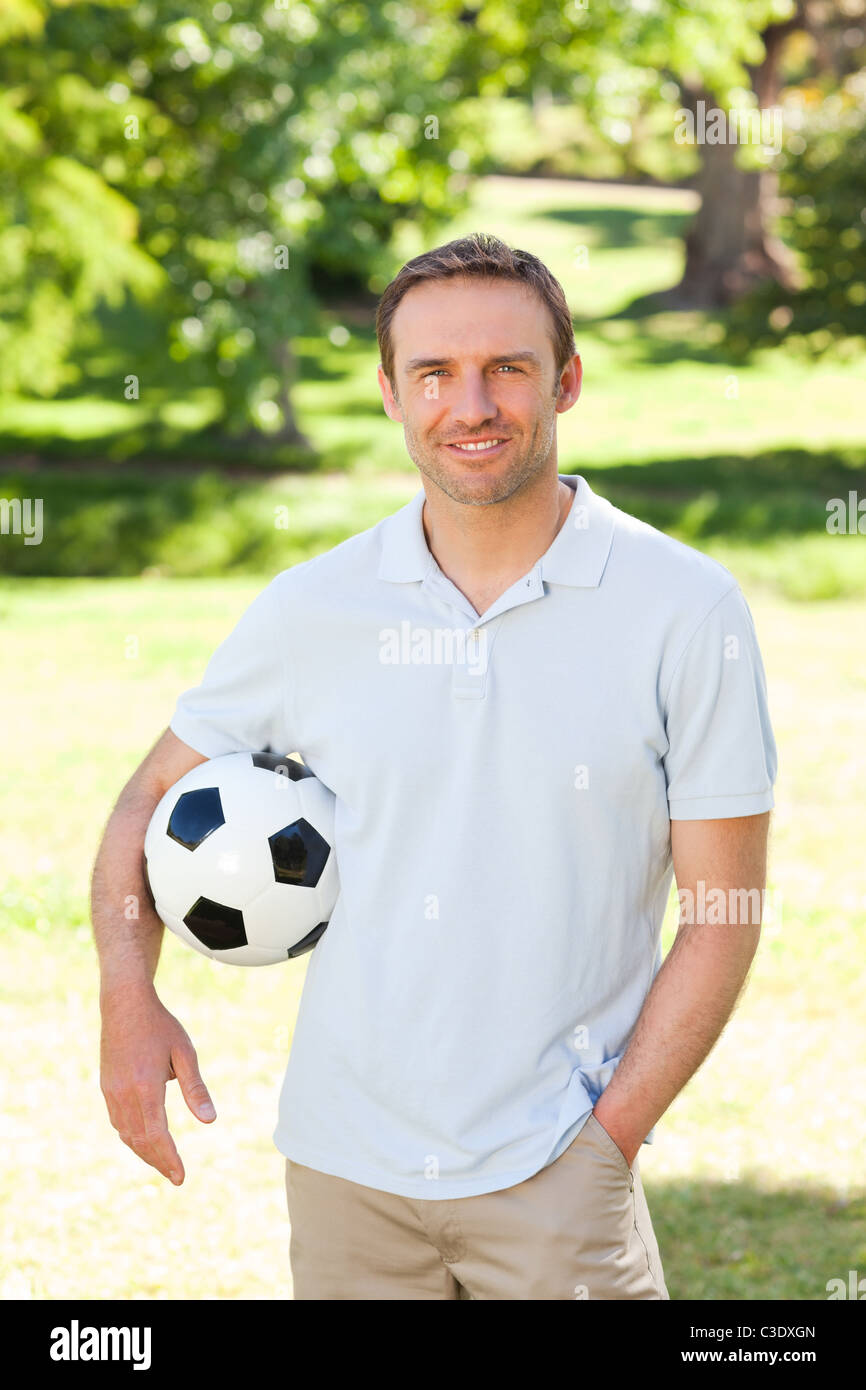 Handsome man with a ball Stock Photo - Alamy