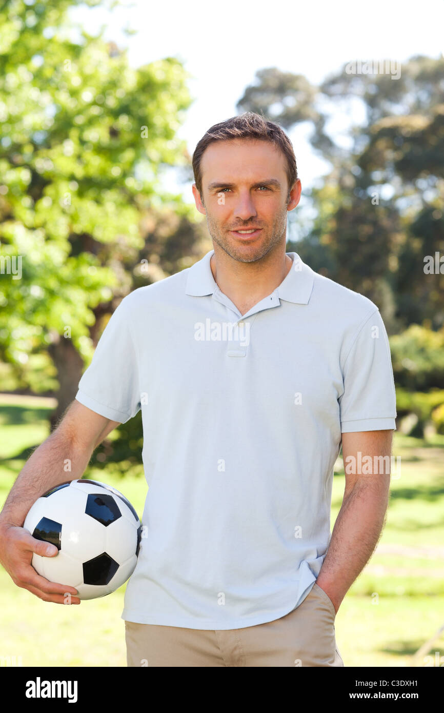 Handsome man with a ball Stock Photo - Alamy