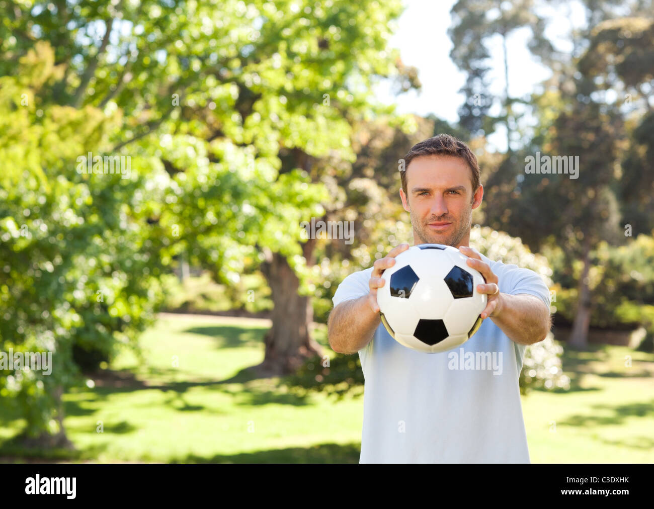 Handsome man with a ball Stock Photo - Alamy