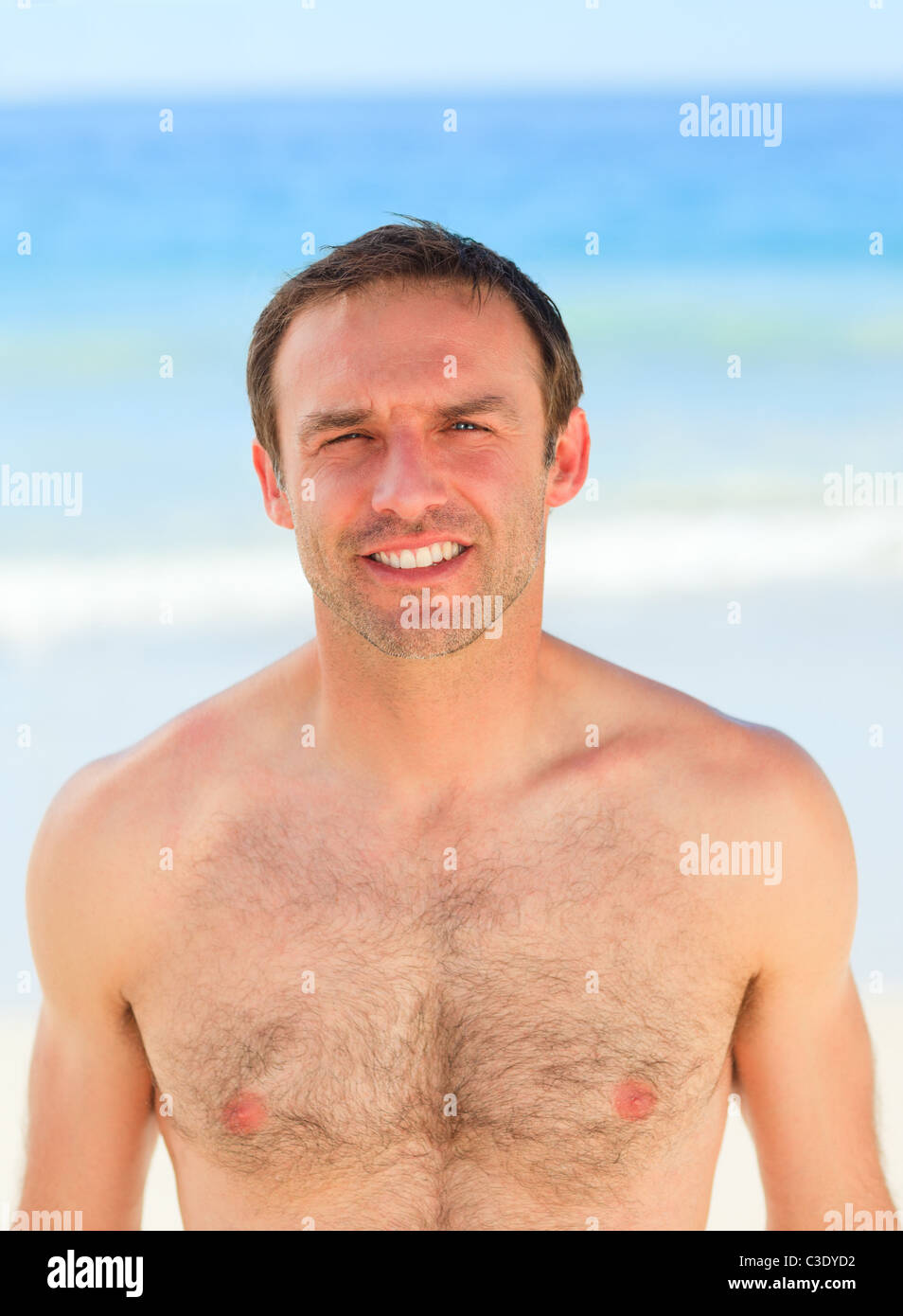 Handsome man on the beach Stock Photo - Alamy