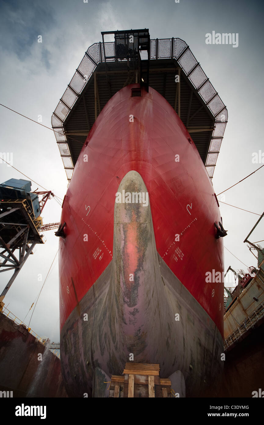 Vessel in drydock for repairs on the hull Stock Photo - Alamy