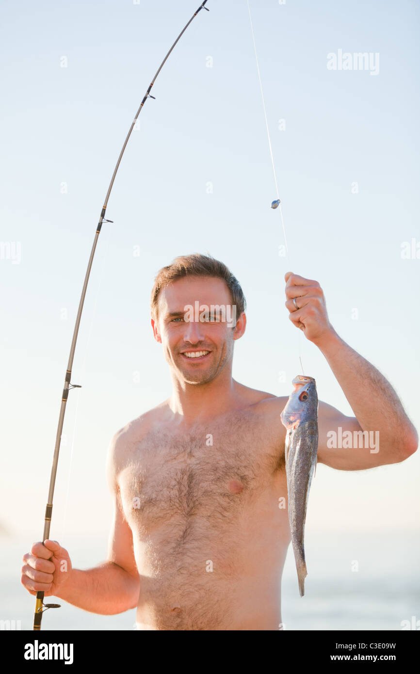 Active man fishing Stock Photo - Alamy