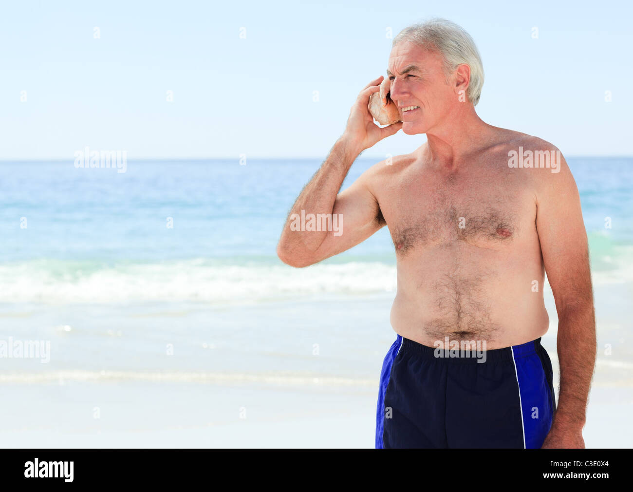 Man listening shell hi-res stock photography and images - Alamy