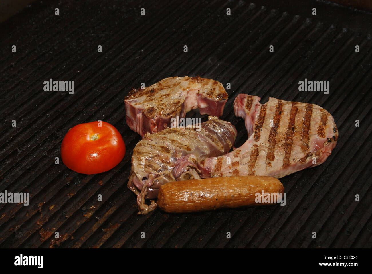 image of mini mixed grill cooking on griddle Stock Photo - Alamy