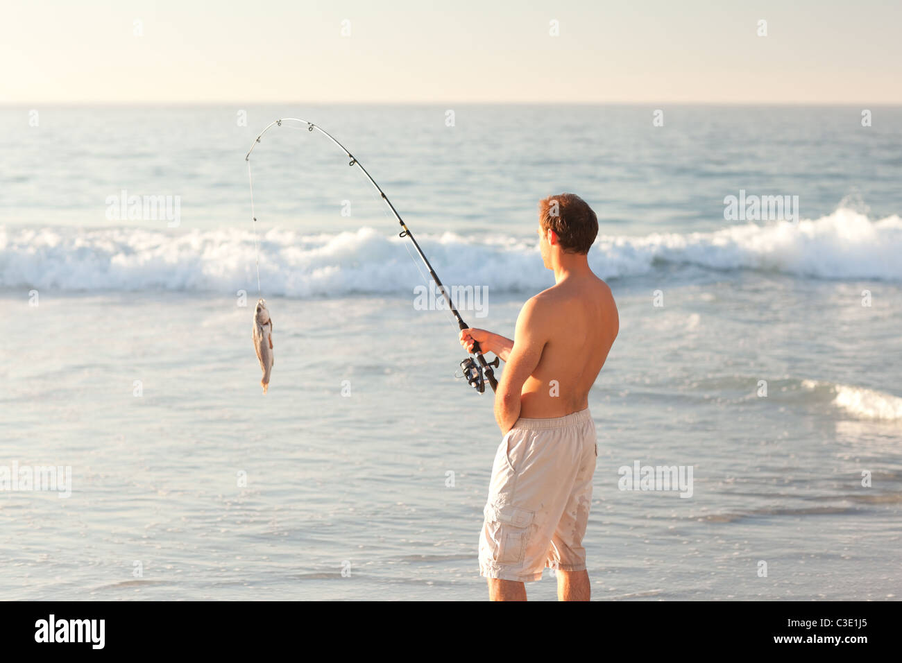 Active man fishing Stock Photo - Alamy
