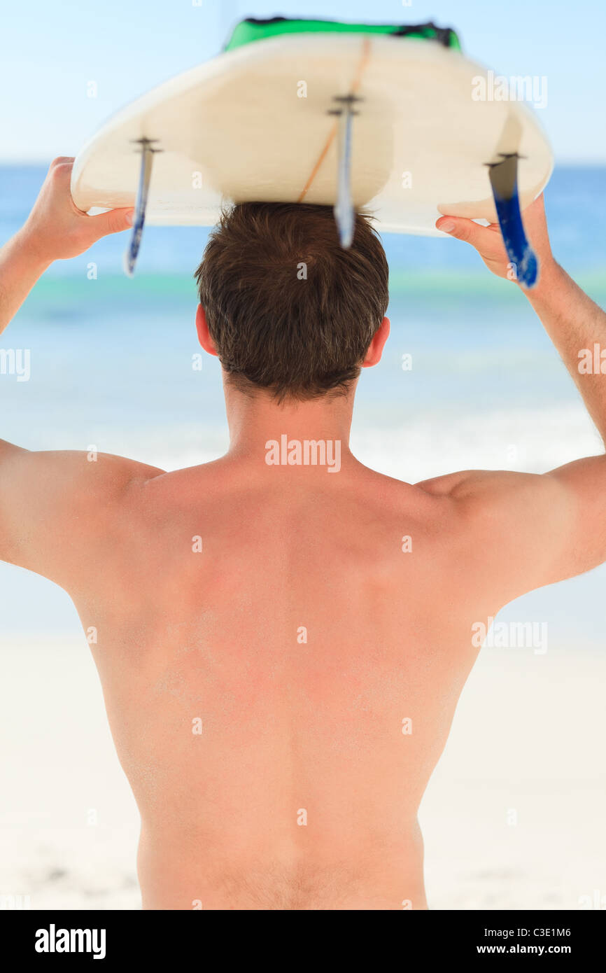 Man with his surfboard Stock Photo - Alamy
