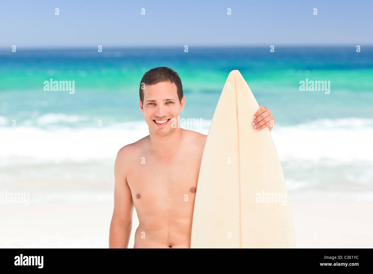 Man with his surfboard Stock Photo - Alamy