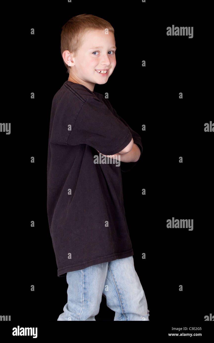 A boy is standing with his arms crossed and he is smiling Stock Photo ...