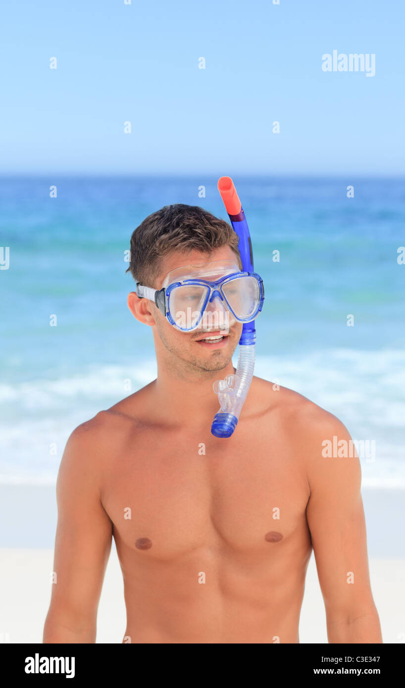 Man with his mask at the beach Stock Photo - Alamy