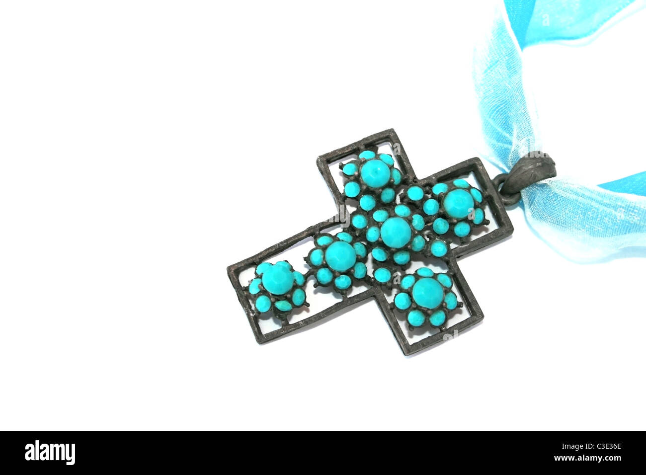 Metallic cross with blue stones and ribbons on the white Stock Photo ...