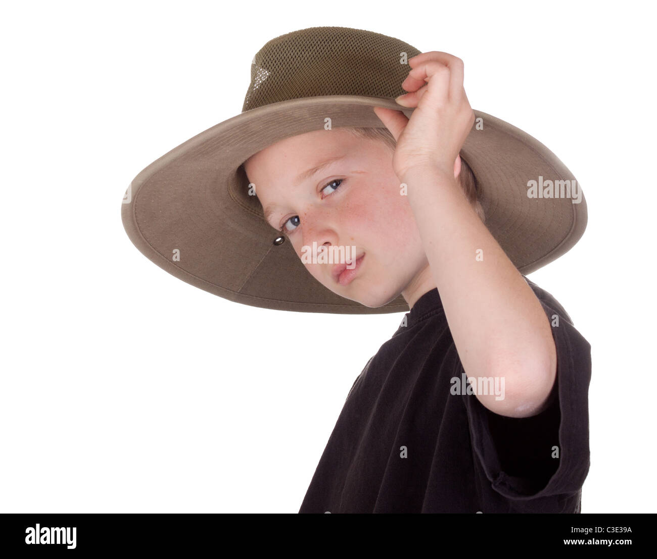 A photograph of a young boy tipping his hat with a small grin on his ...