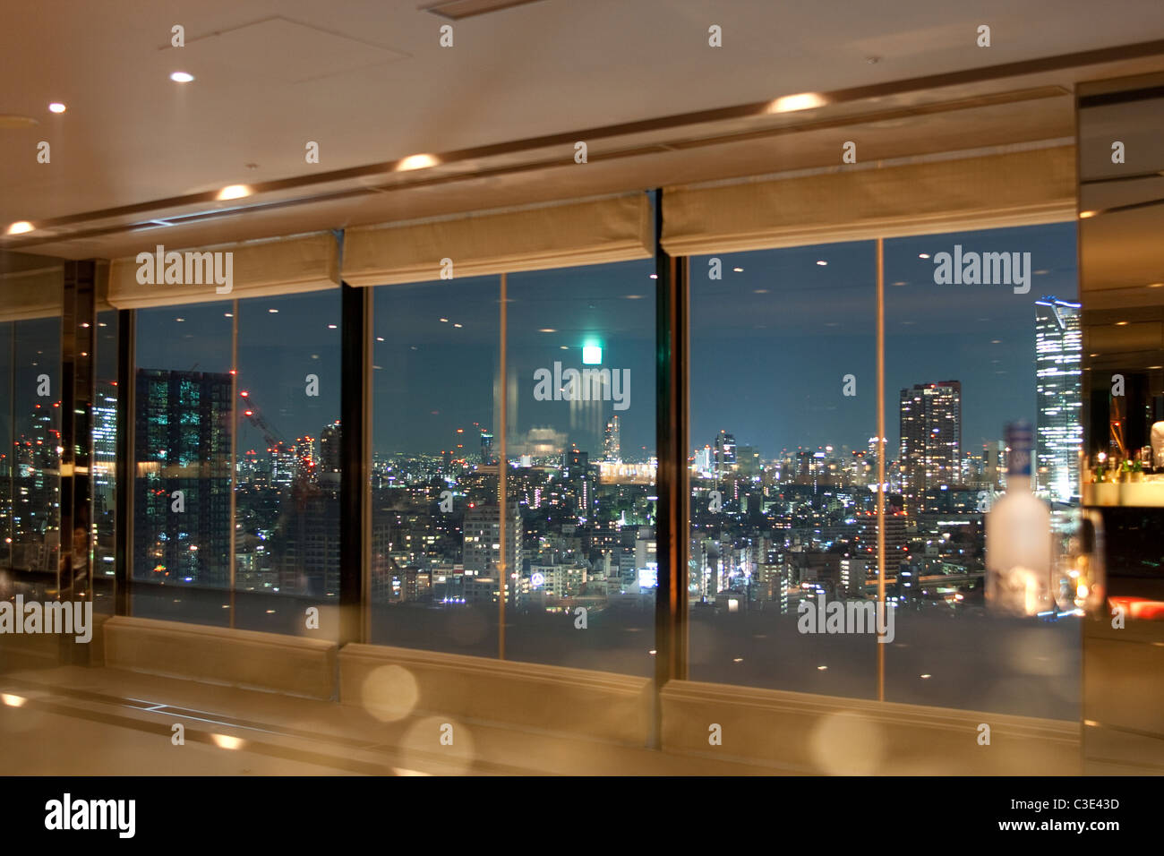 View on Tokyo and skytower by night through windows with some ...