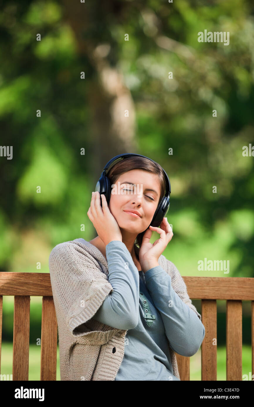 Young woman listening to some music Stock Photo - Alamy