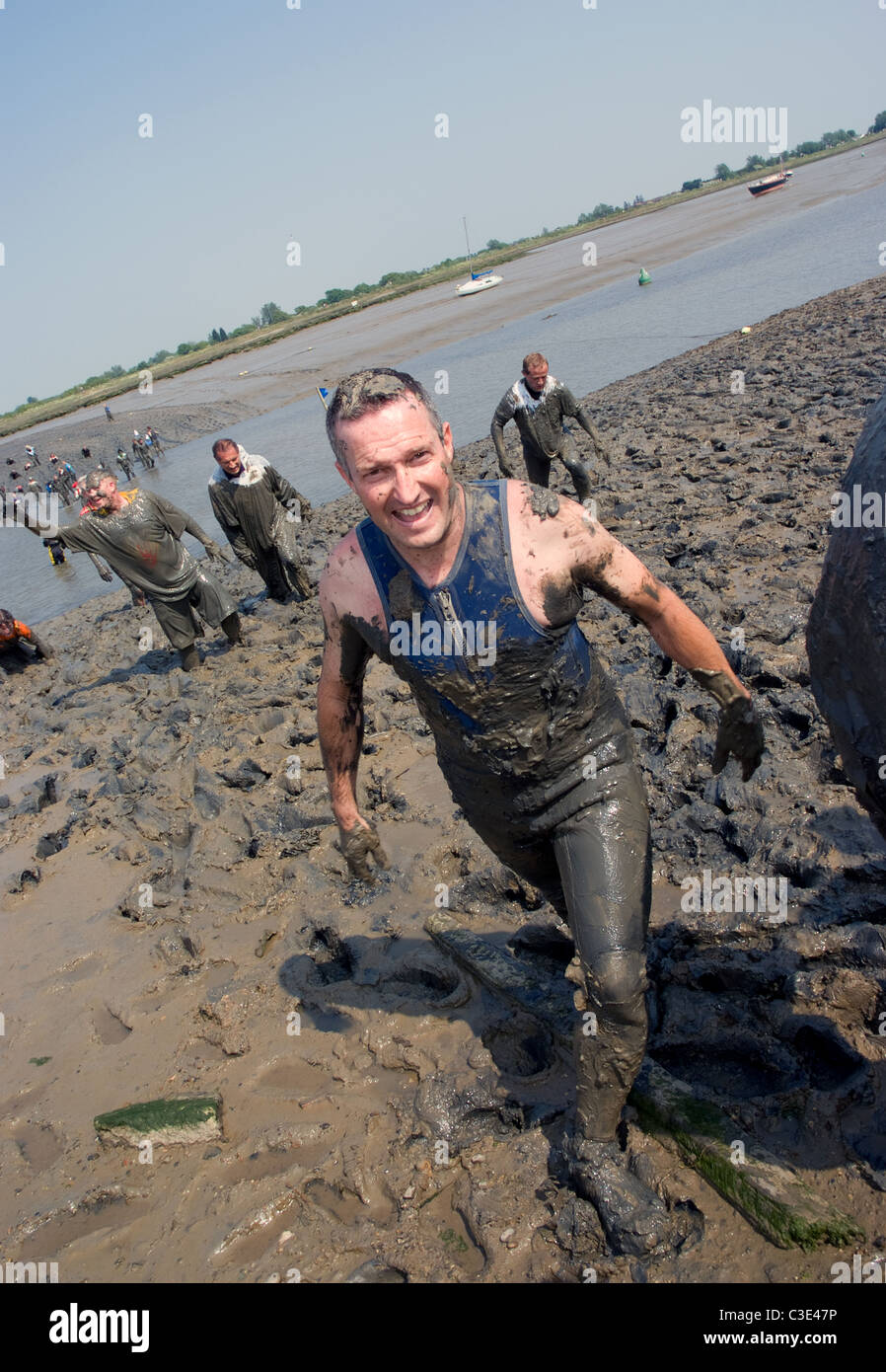 maldon mud runner close to the finishing line Stock Photo - Alamy