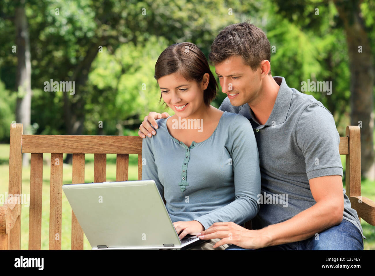 Couple working on their laptop Stock Photo - Alamy