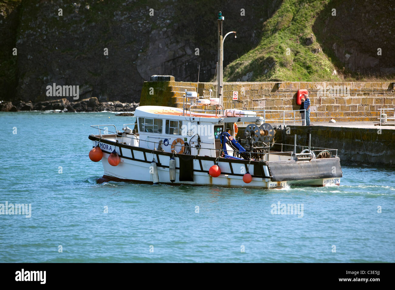 Fishing boat sailing from Stonehaven harbour Scotland UK Stock Photo ...
