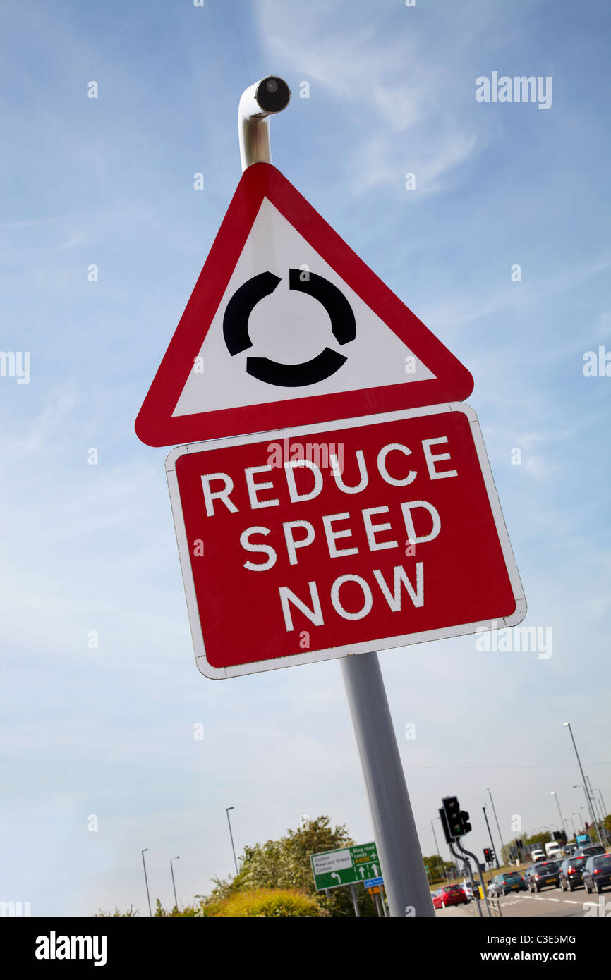 Reduce speed now sign for roundabout in England. Showing traffic and ...