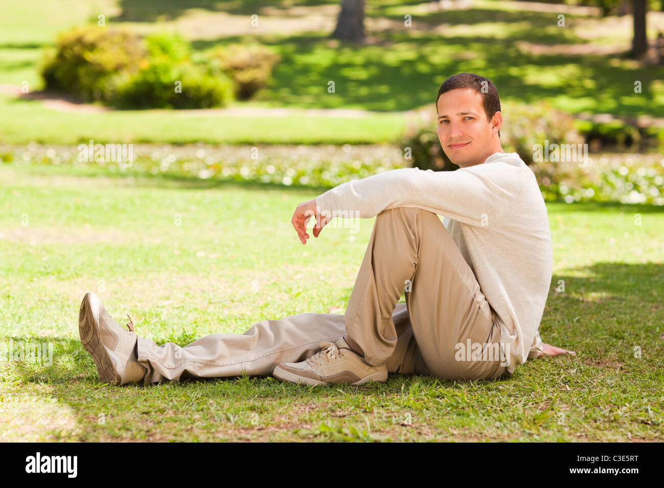 Handsome man in the park Stock Photo - Alamy