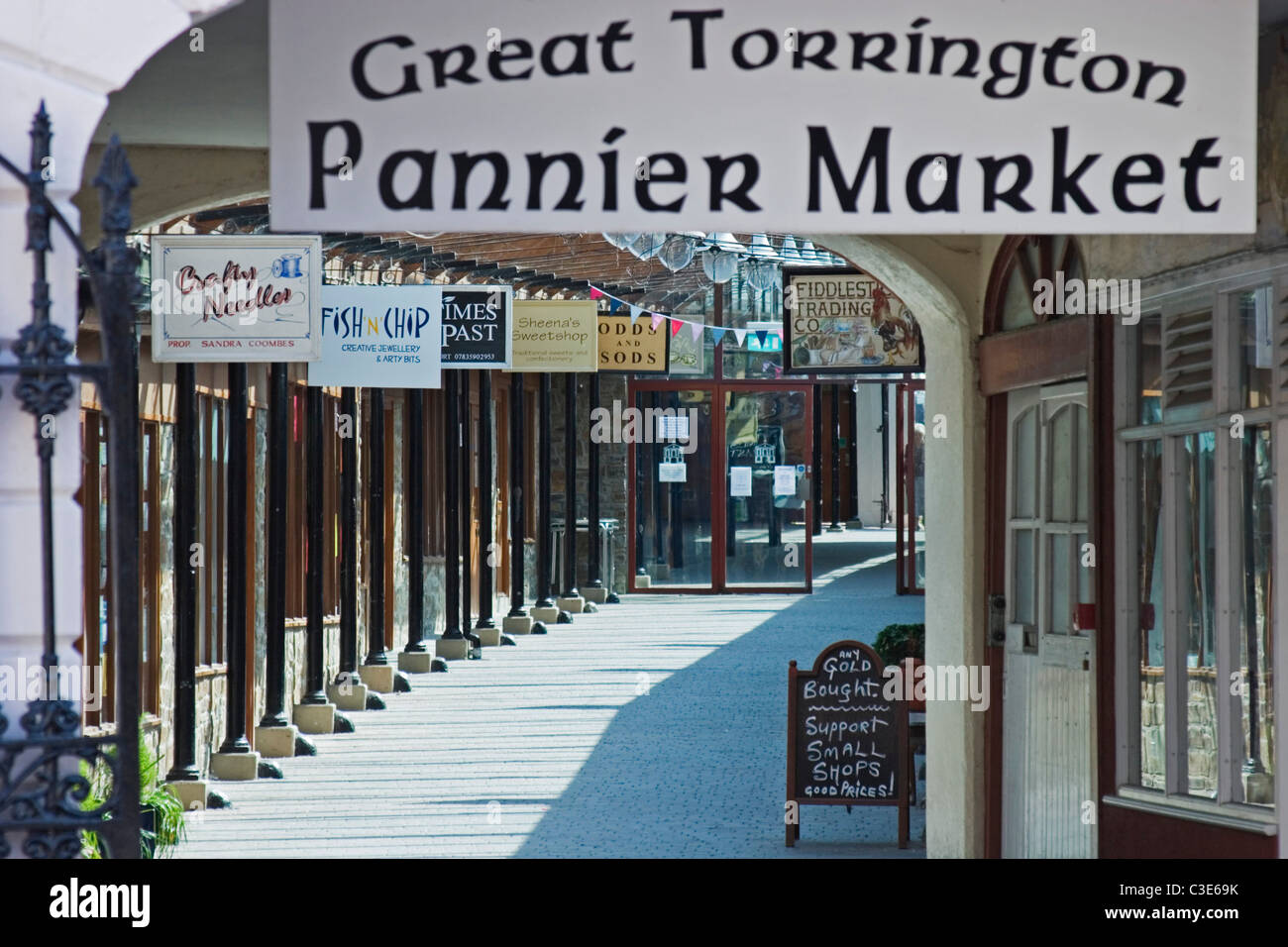 Pannier Market in Great Torrington, Devon, with row of small shops and ...