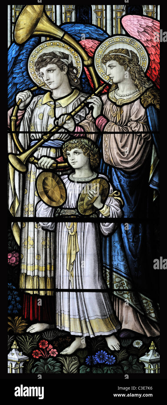 Stained glass window depicting two musical angels, and a child, in ...