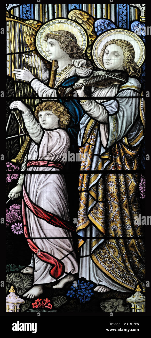 Stained glass window depicting musical angels, and a child, in concert ...