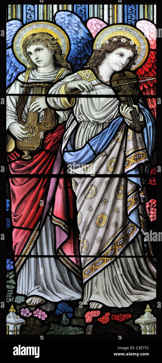 Stained glass window depicting angels playing a lyre and a rebec ...