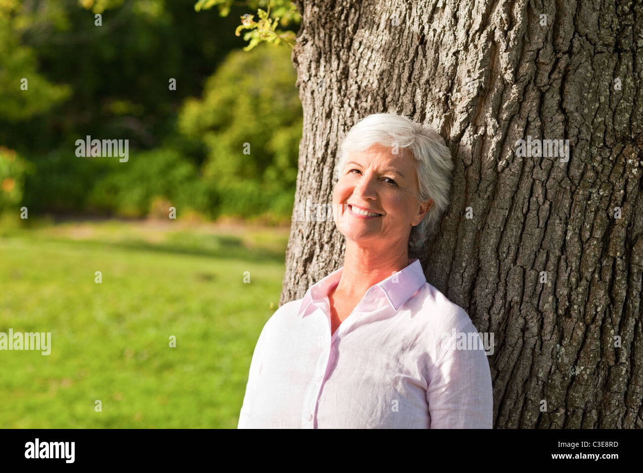 Senior woman in the park Stock Photo - Alamy