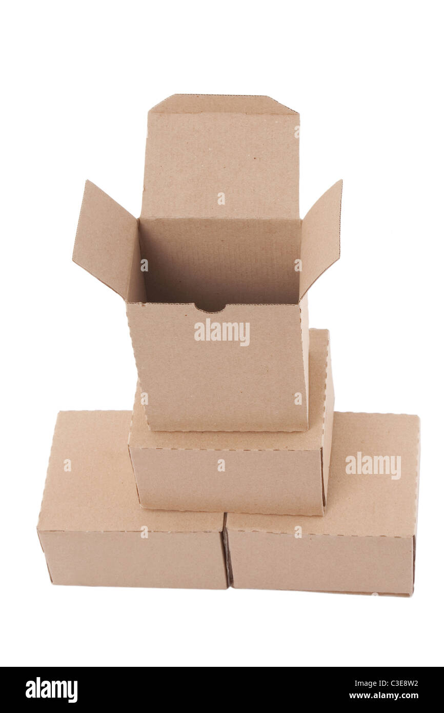 Brown cardboard boxes arranged in stack on white background Stock Photo ...