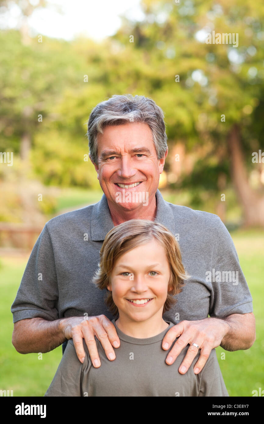 Grandfather with his grandson in the park Stock Photo - Alamy