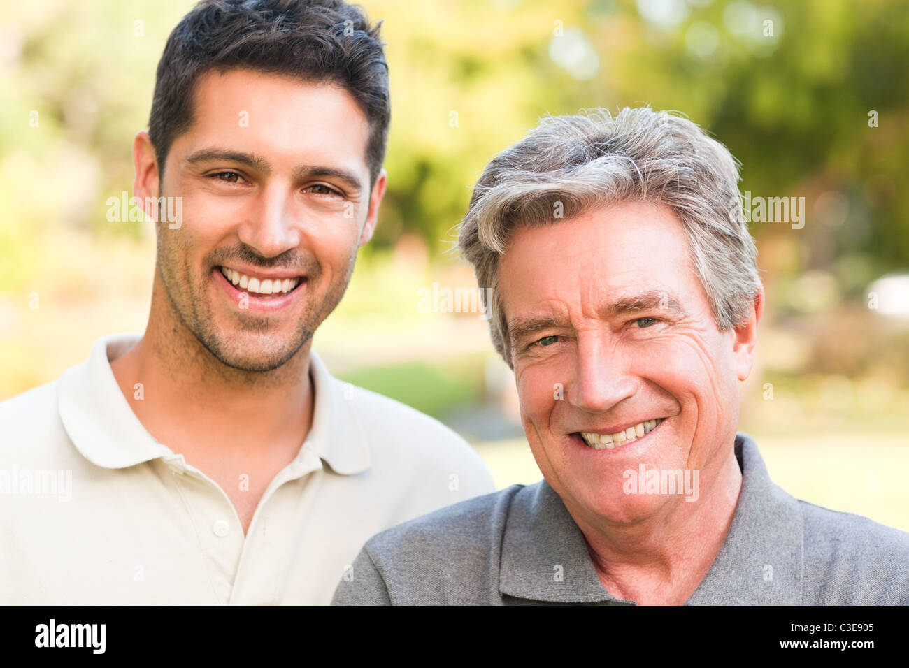 Father with his son looking at the camera Stock Photo - Alamy