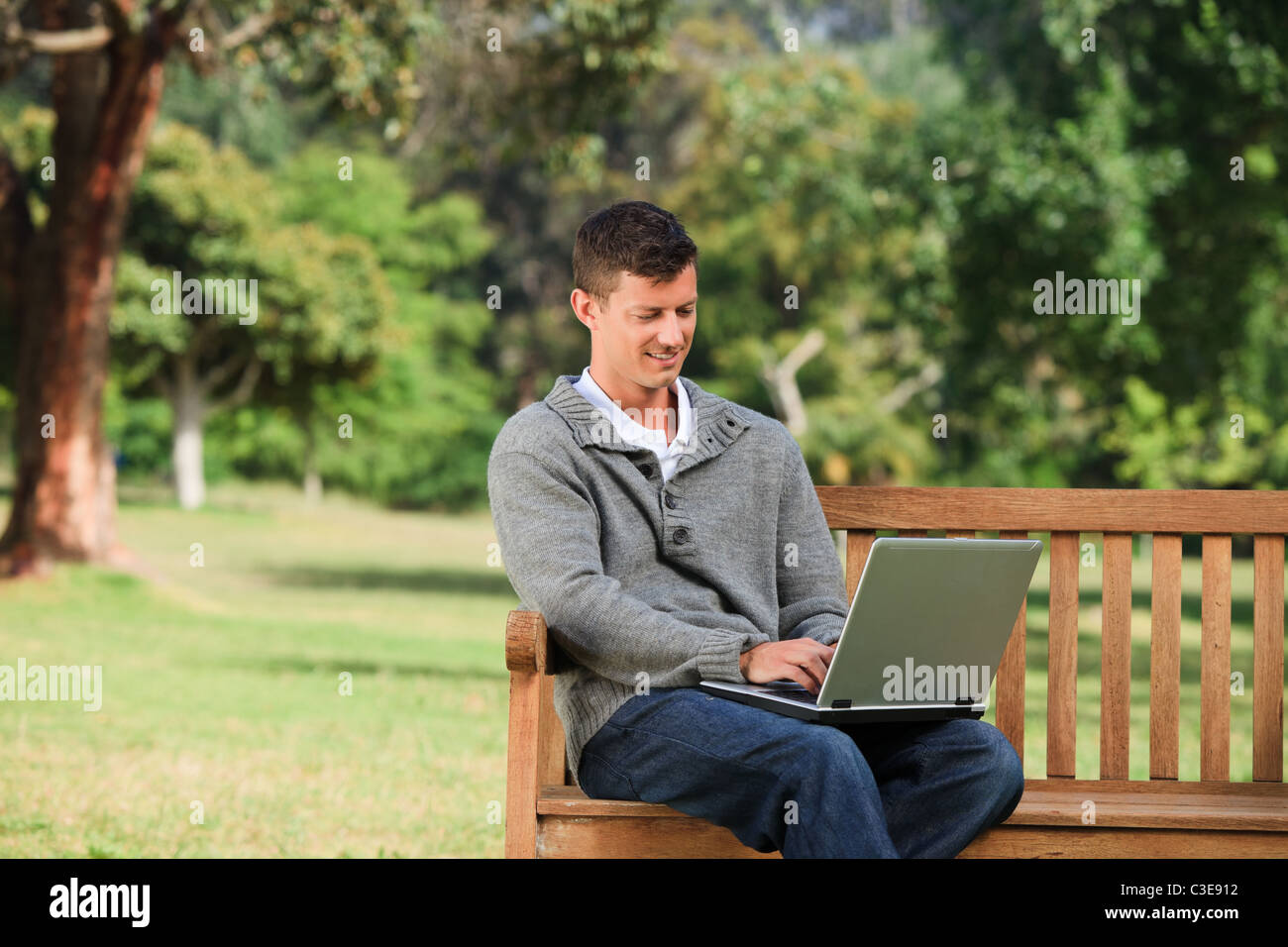 Man working on his laptop Stock Photo - Alamy