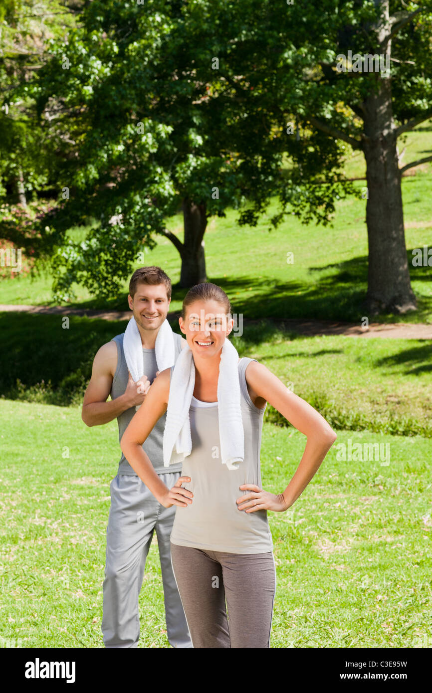 Exhausted couple in the park Stock Photo - Alamy