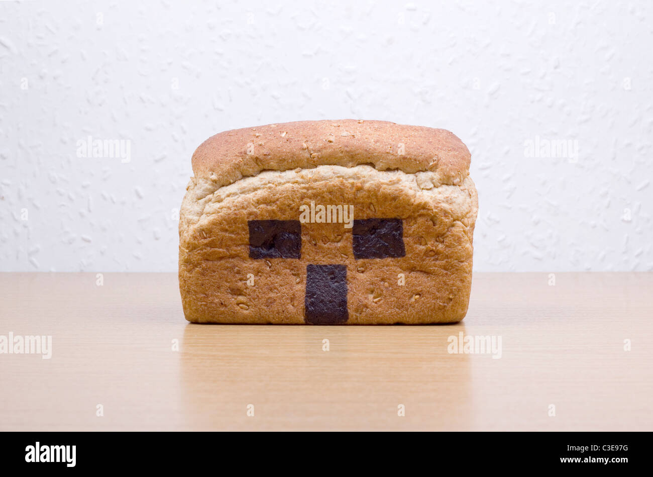 conceptual image of a loaf of bread which looks like a house. Wholesome ...