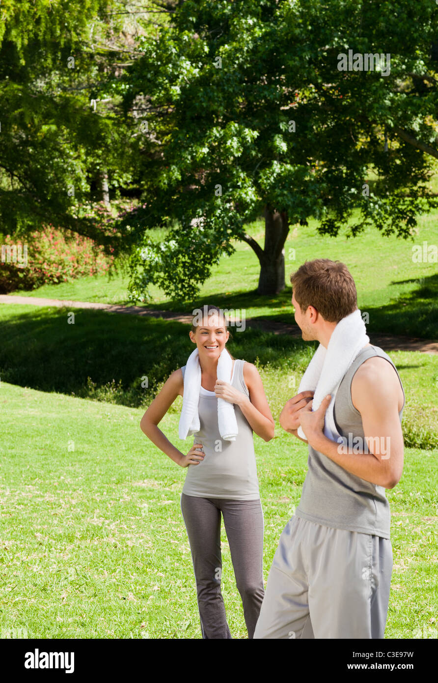 Exhausted couple in the park Stock Photo - Alamy