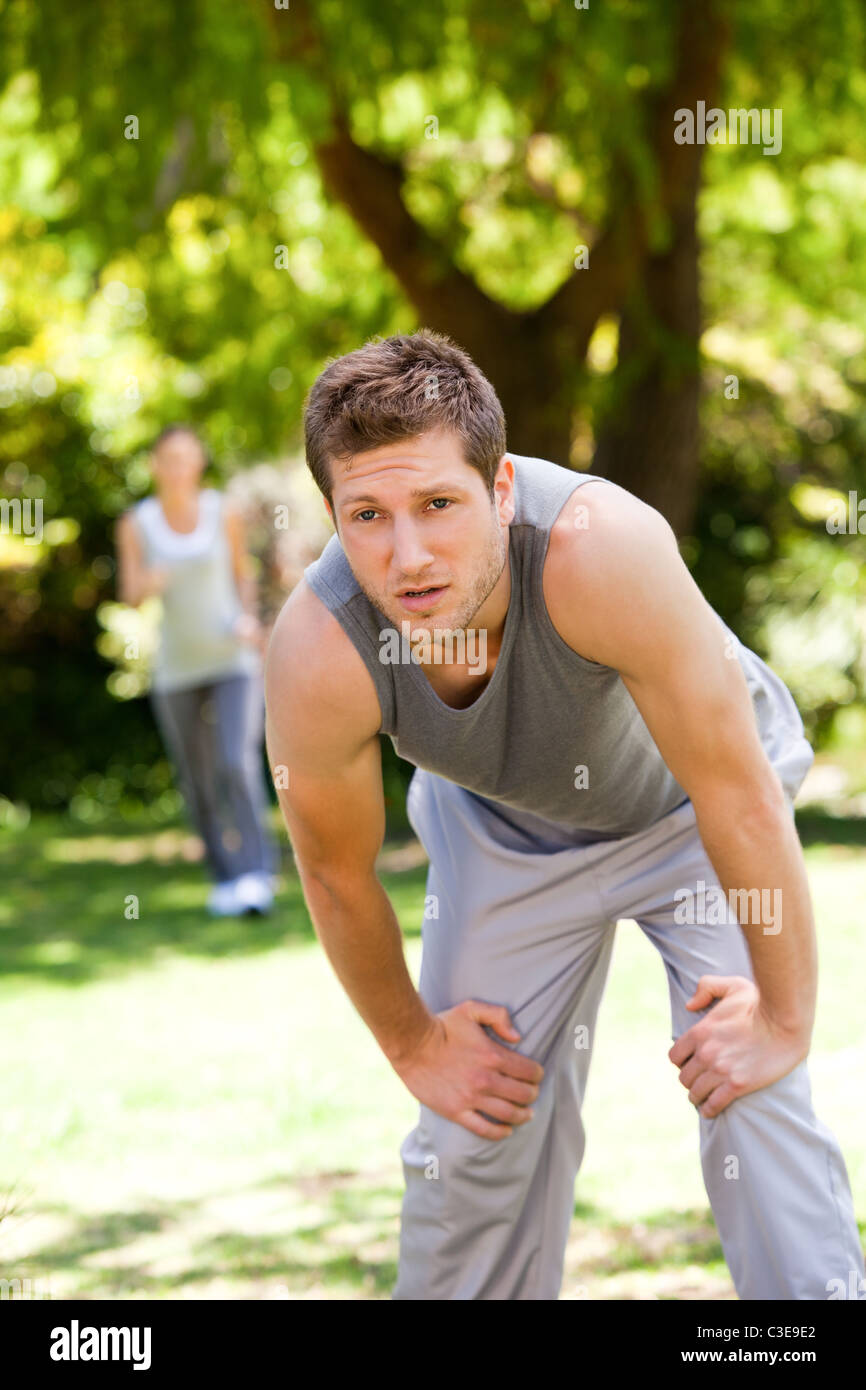 Tired couple in the park Stock Photo - Alamy