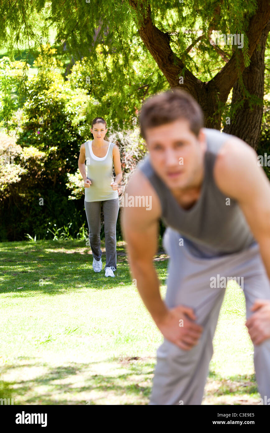Tired couple in the park Stock Photo - Alamy