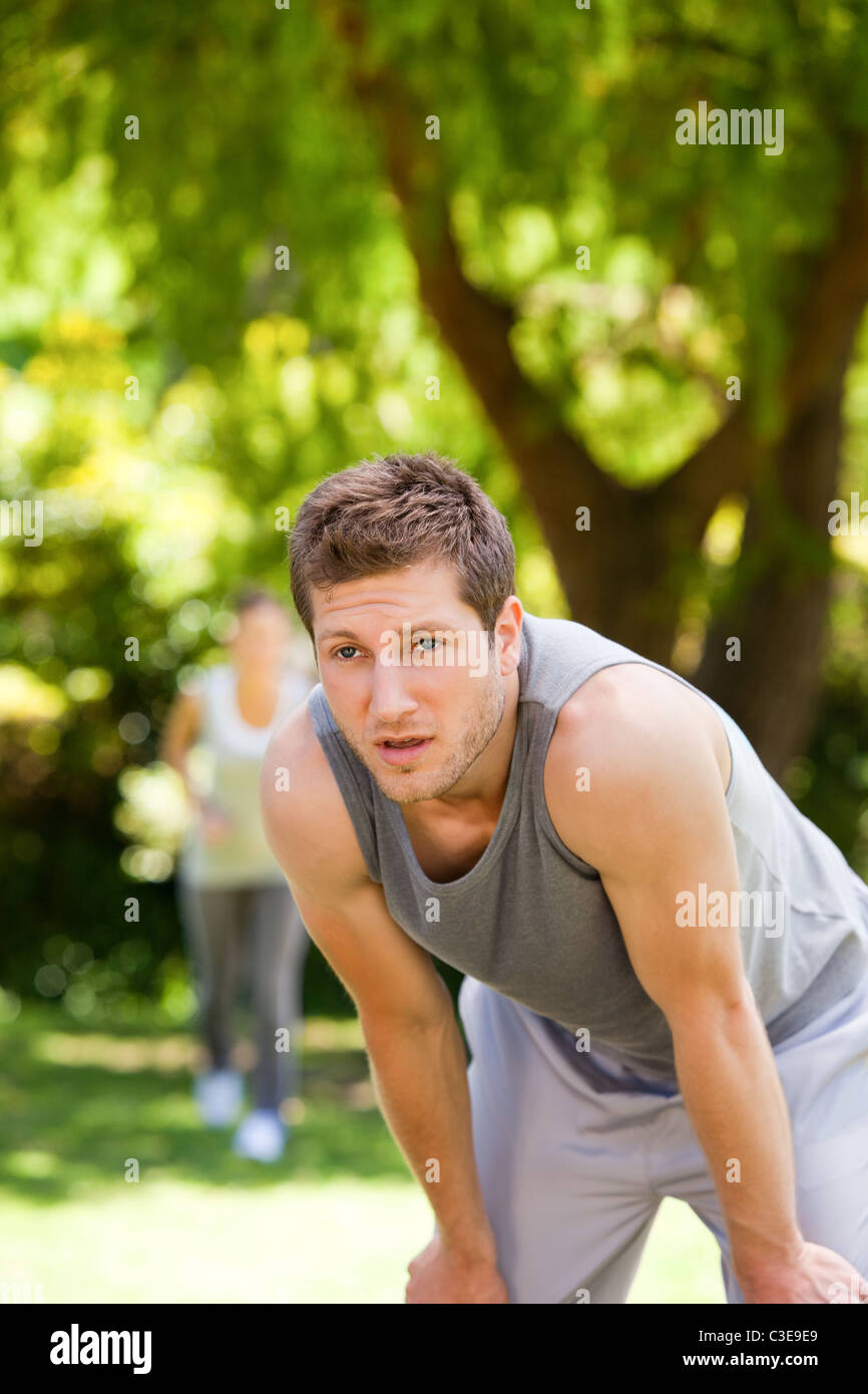 Tired couple in the park Stock Photo - Alamy