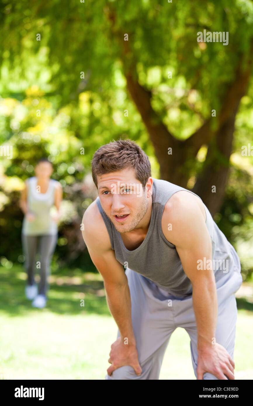 Tired couple in the park Stock Photo - Alamy