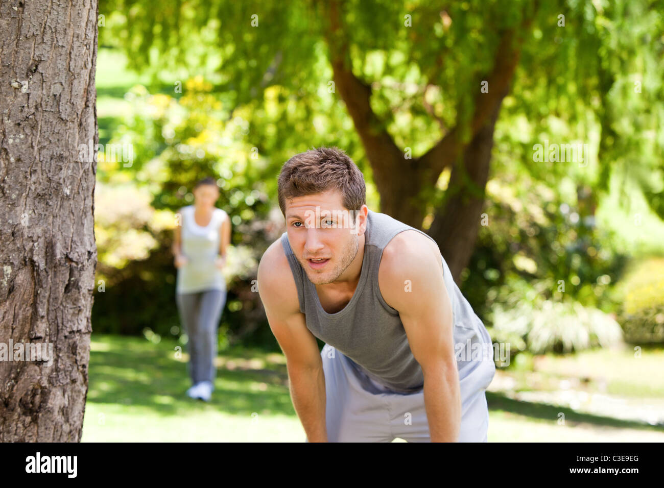 Tired couple in the park Stock Photo - Alamy