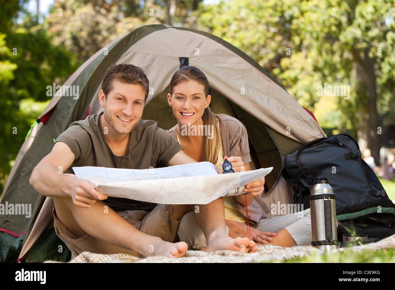 Couple camping in the park Stock Photo - Alamy