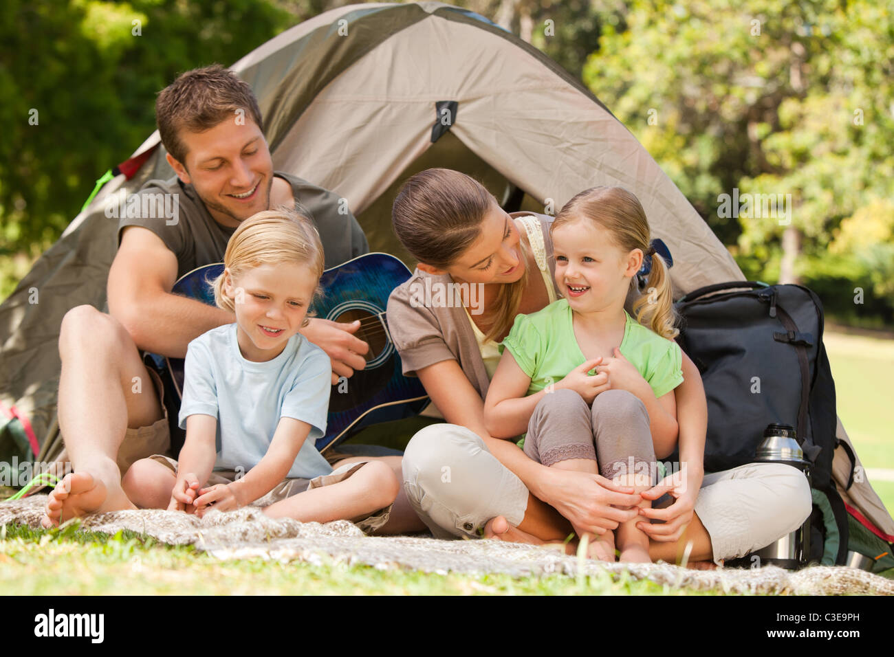 Family camping in the park Stock Photo - Alamy