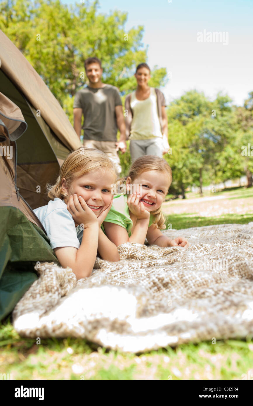Happy family camping in the park Stock Photo - Alamy