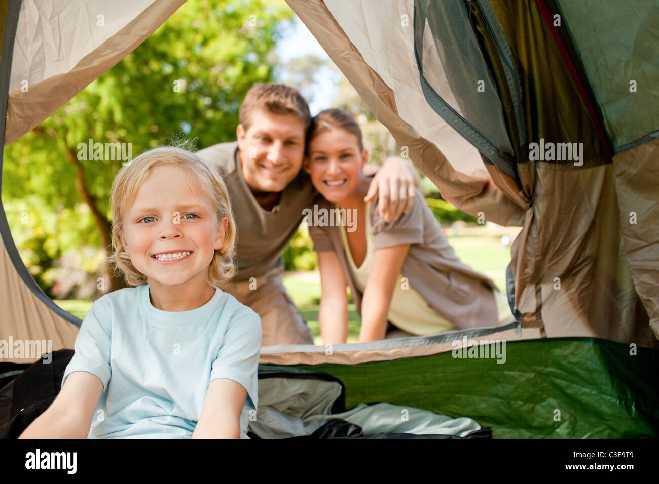Happy family camping in the park Stock Photo - Alamy