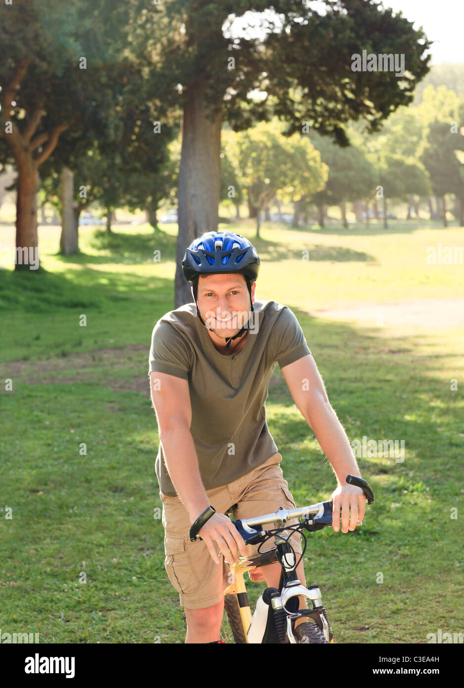 Young man with his bike Stock Photo - Alamy